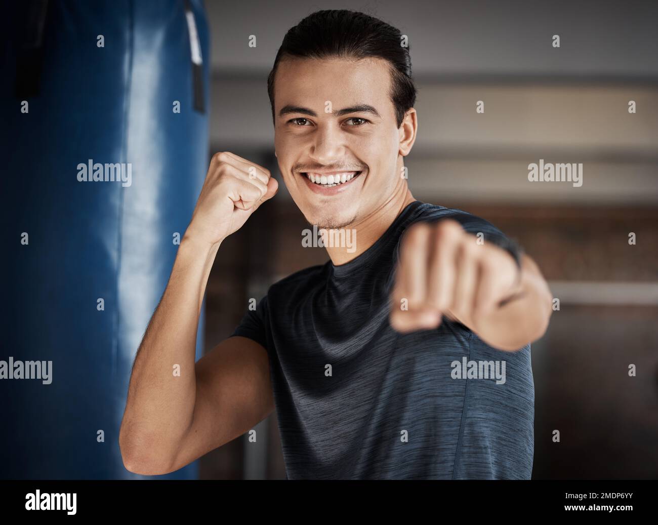 Man, smile portrait and fist fight for fitness in gym for exercise ...