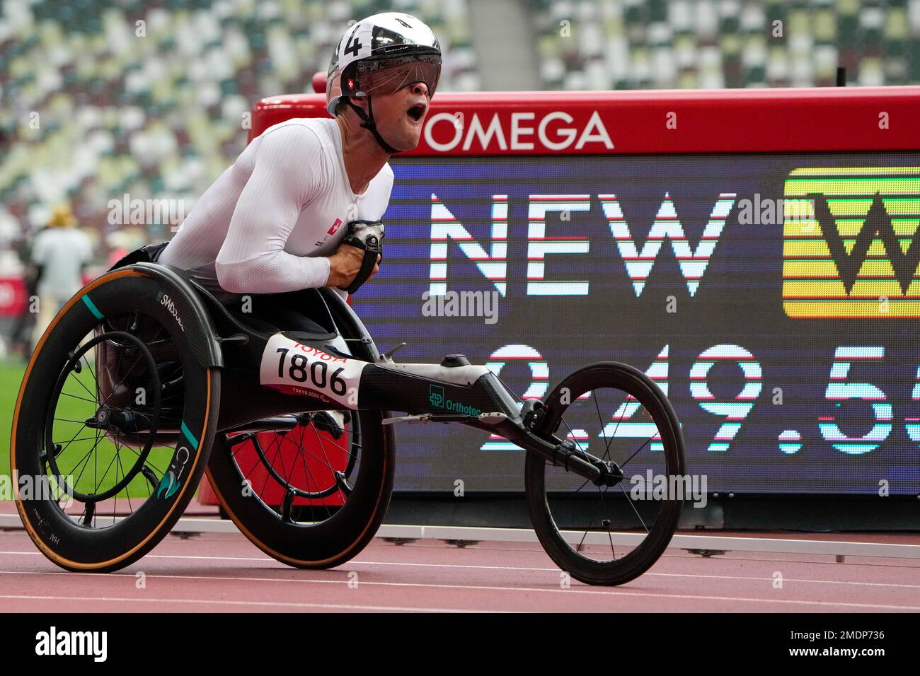 Switzerland's Marcel Hug celebrates after winning the men's T54 1500 ...