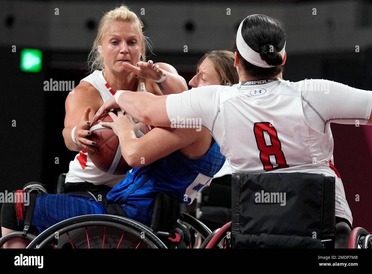 United States' Courtney Ryan battles for the ball against Canada's ...