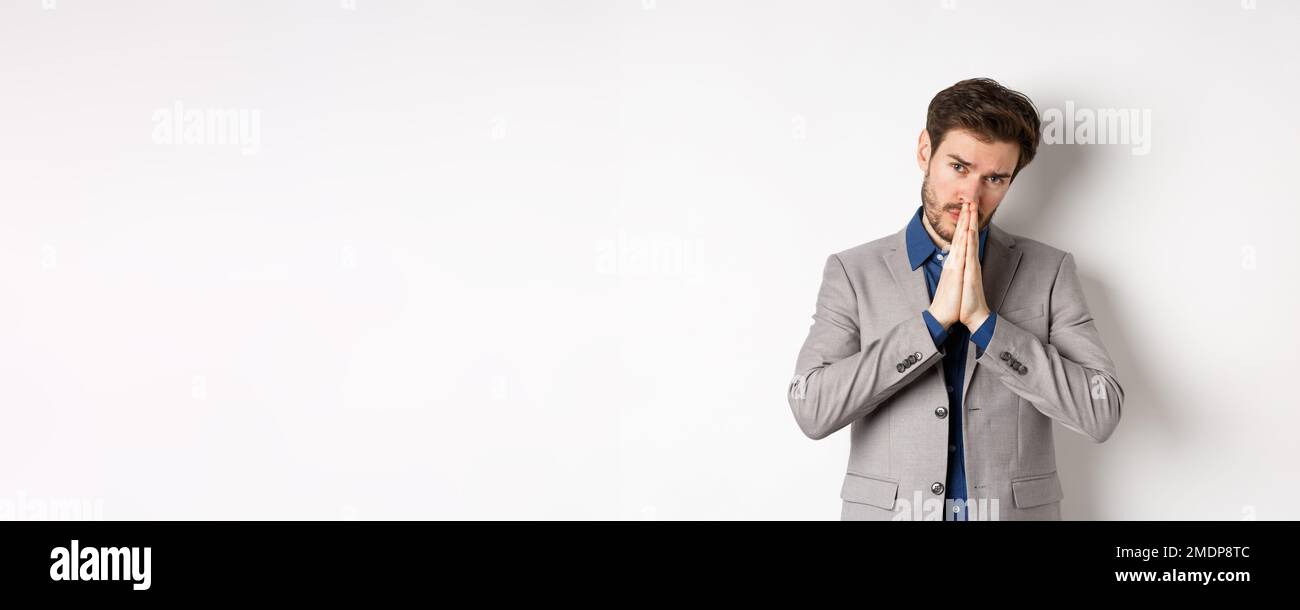 Please help. Pleading man in suit asking for favour, begging you ...