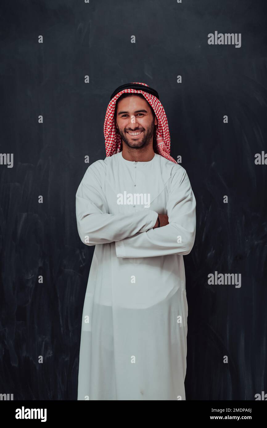 Portrait of young muslim man wearing traditional clothes Stock Photo ...
