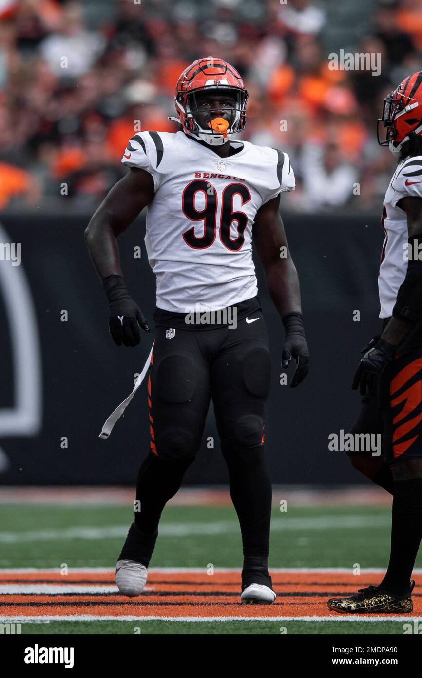 Cincinnati Bengals defensive end Cam Sample (96) watches a replay on ...