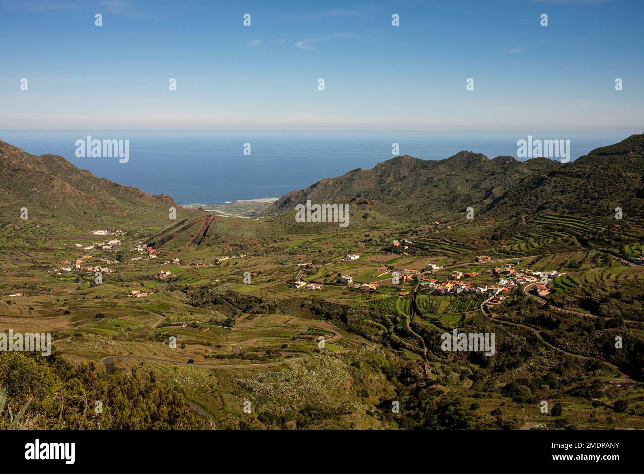 View over the Palmar valley to the north coast at Los Silos with green ...