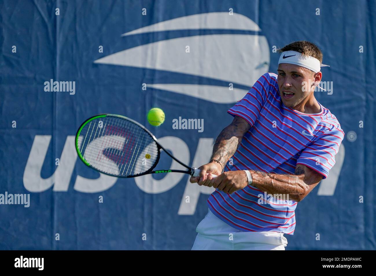 Alex Molcan, of Slovakia, returns a shot to Cem Ilkel, of Turkey ...