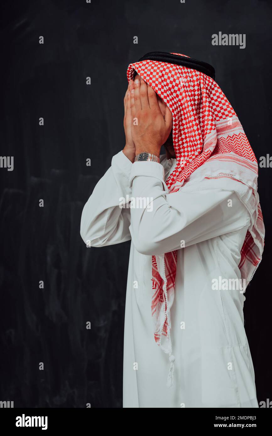 Arabian man in traditional clothes making traditional prayer to God ...