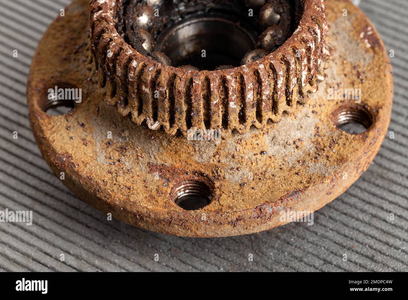 Old rusty wheel hub with a broken bearing. Bearing jamming. Automotive ...