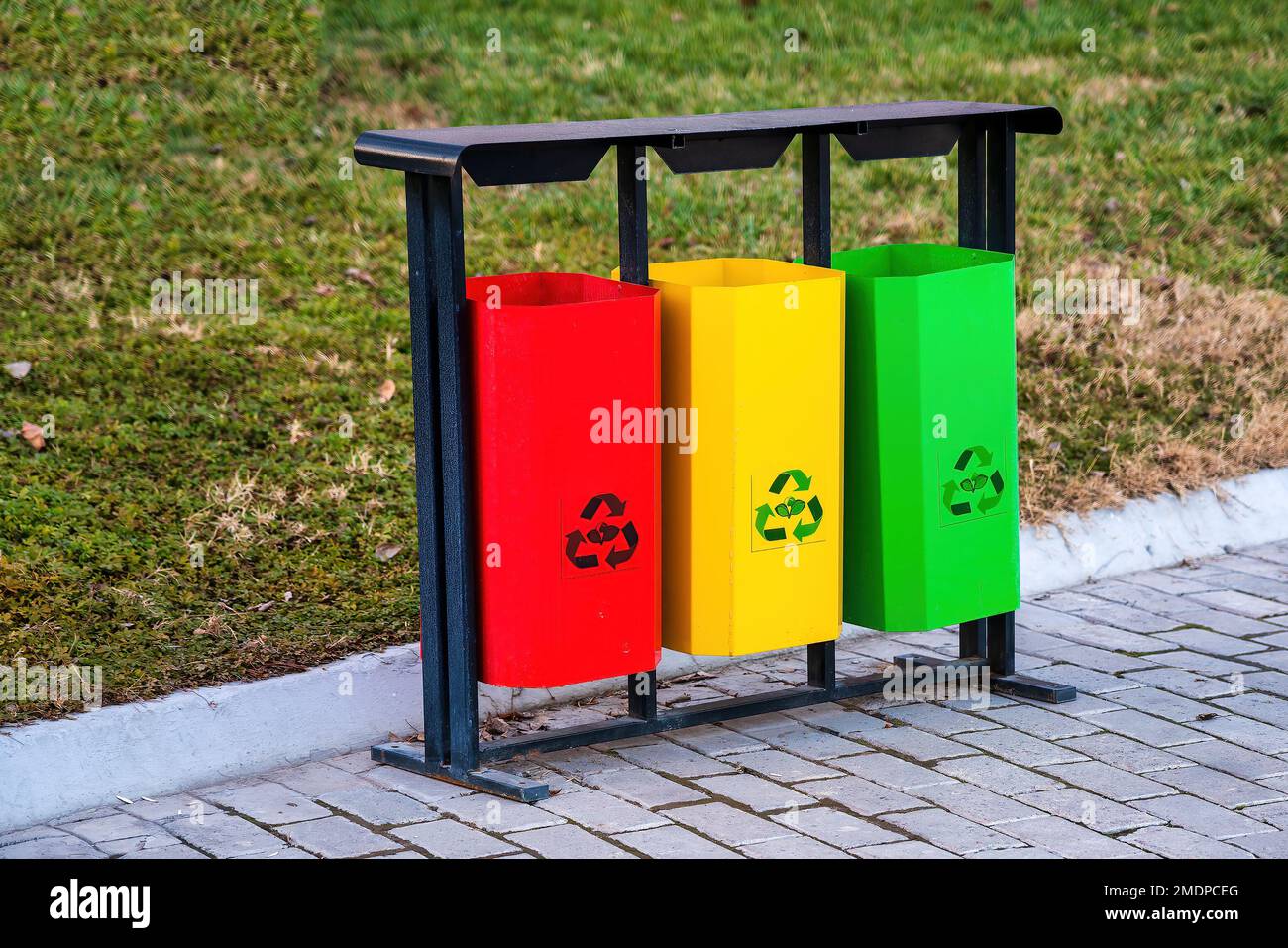 Iron multi-colored containers for separate waste collection. Waste ...