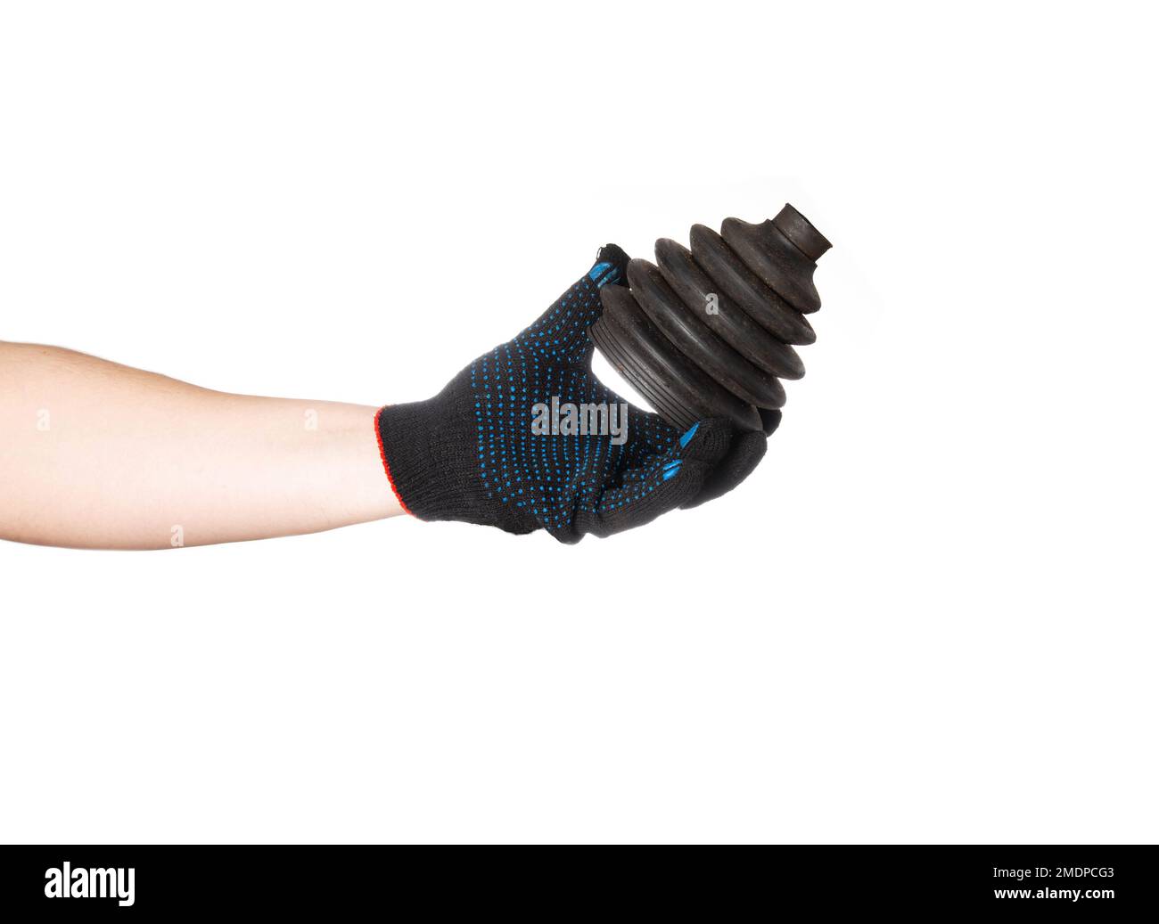 A car mechanic in a glove holds a car boot of a CV joint on a white ...