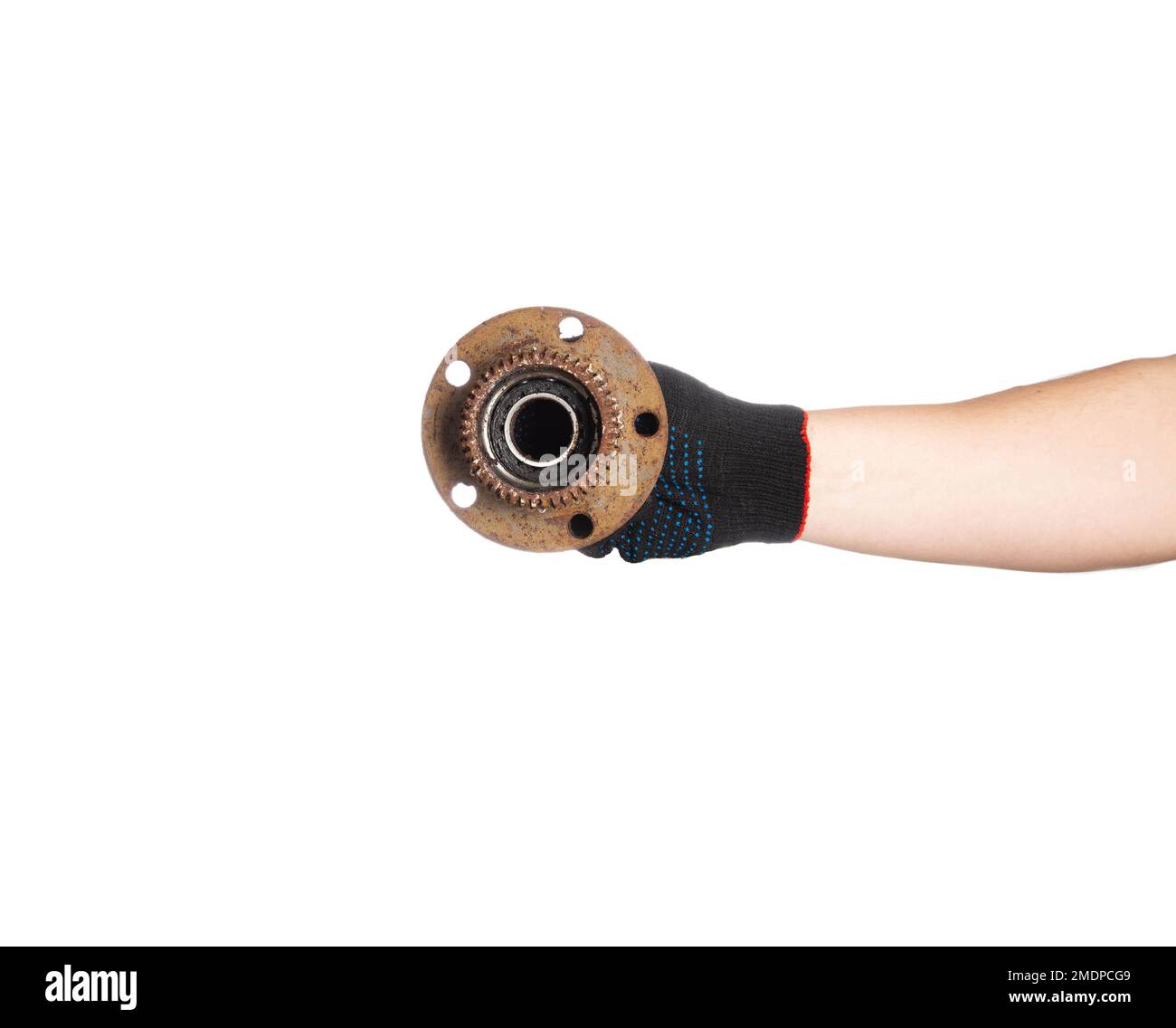 Rusty old hub with a bearing in the hand of a car mechanic on a white ...
