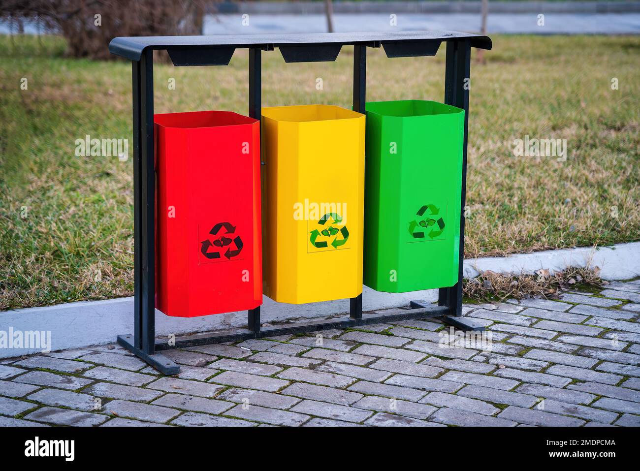 Iron multi-colored containers for separate waste collection. Waste ...