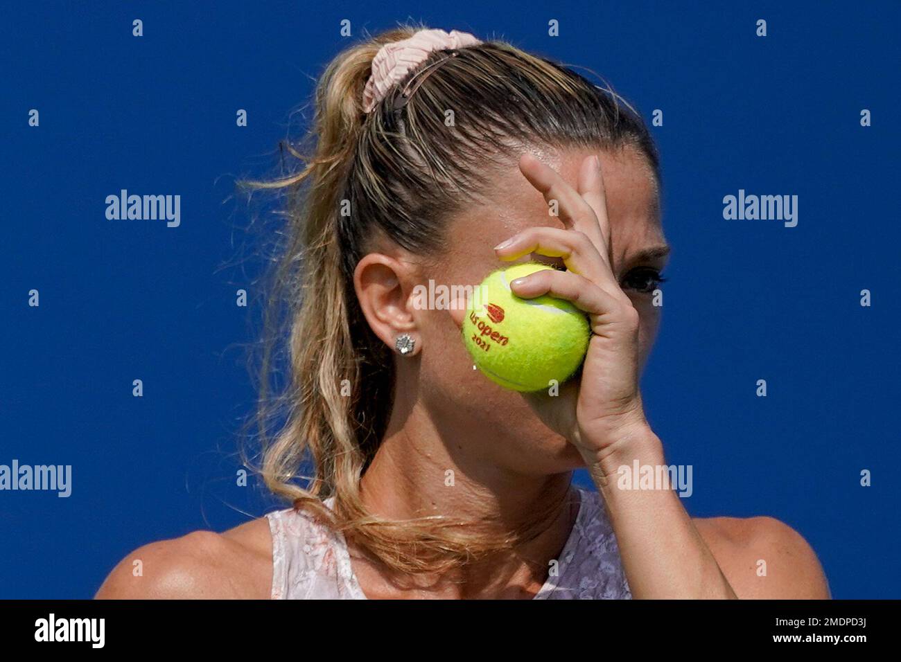 Camila Giorgi, of Italy, prepares to serve to Simona Halep, of Romania ...
