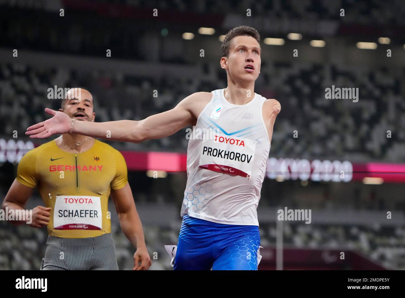 Anton Prokhorov of the Russian Paralympic Committee, front, reacts with ...
