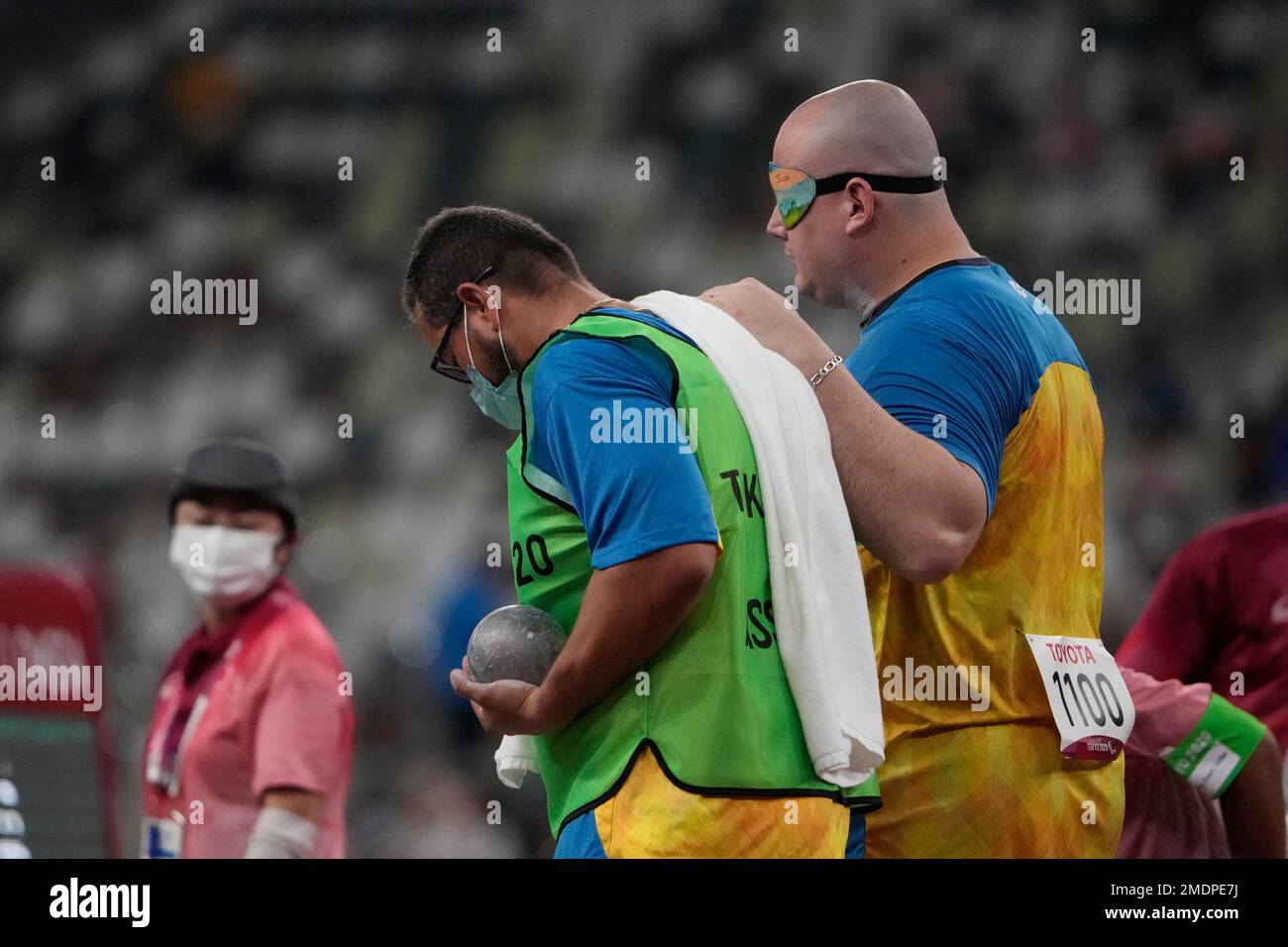 Alessandro Rodrigo da Silva of Brazil, right, walks with an assistant ...