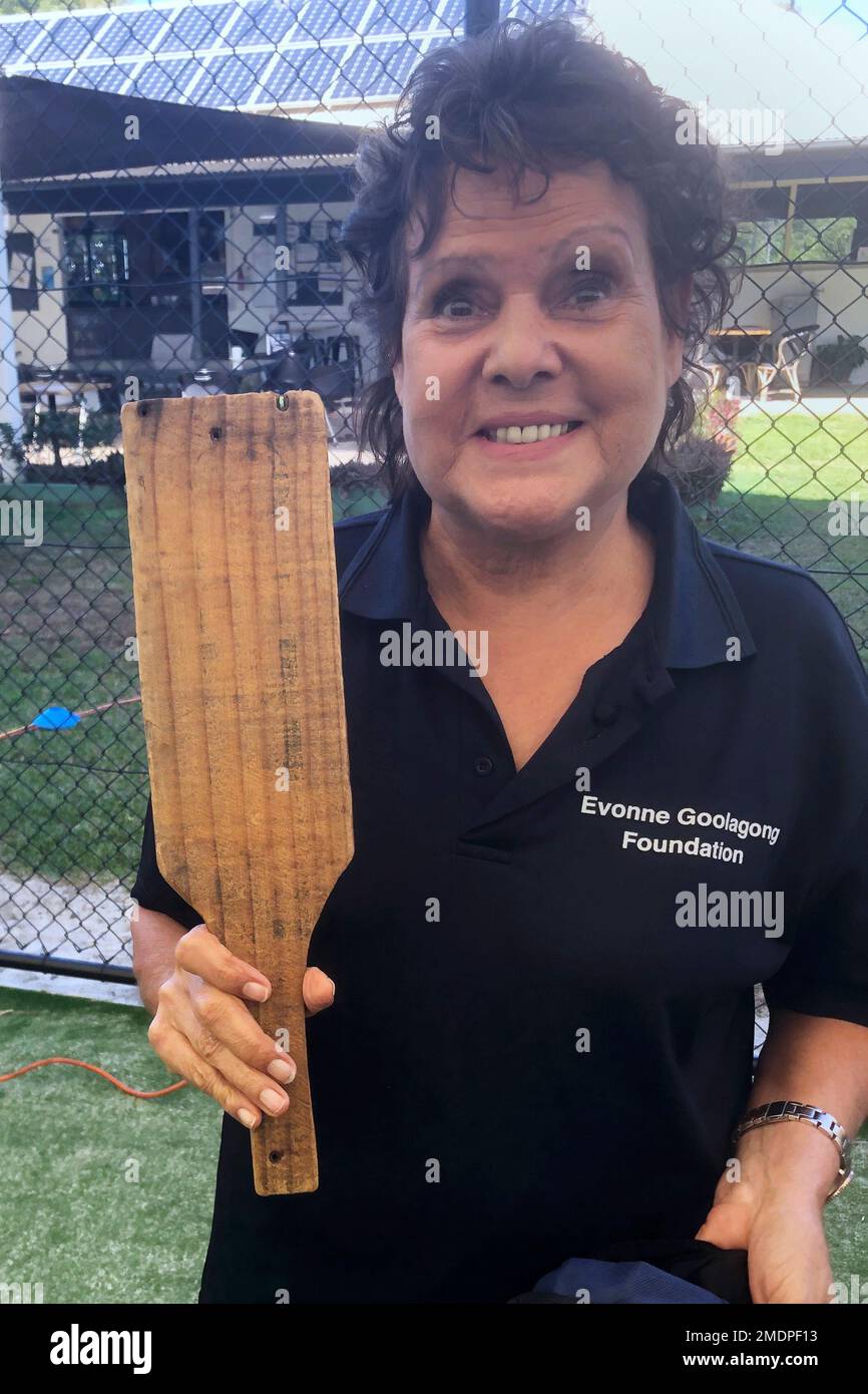 Evonne Goolagong Cawley holds a replica paddle that she used as her ...