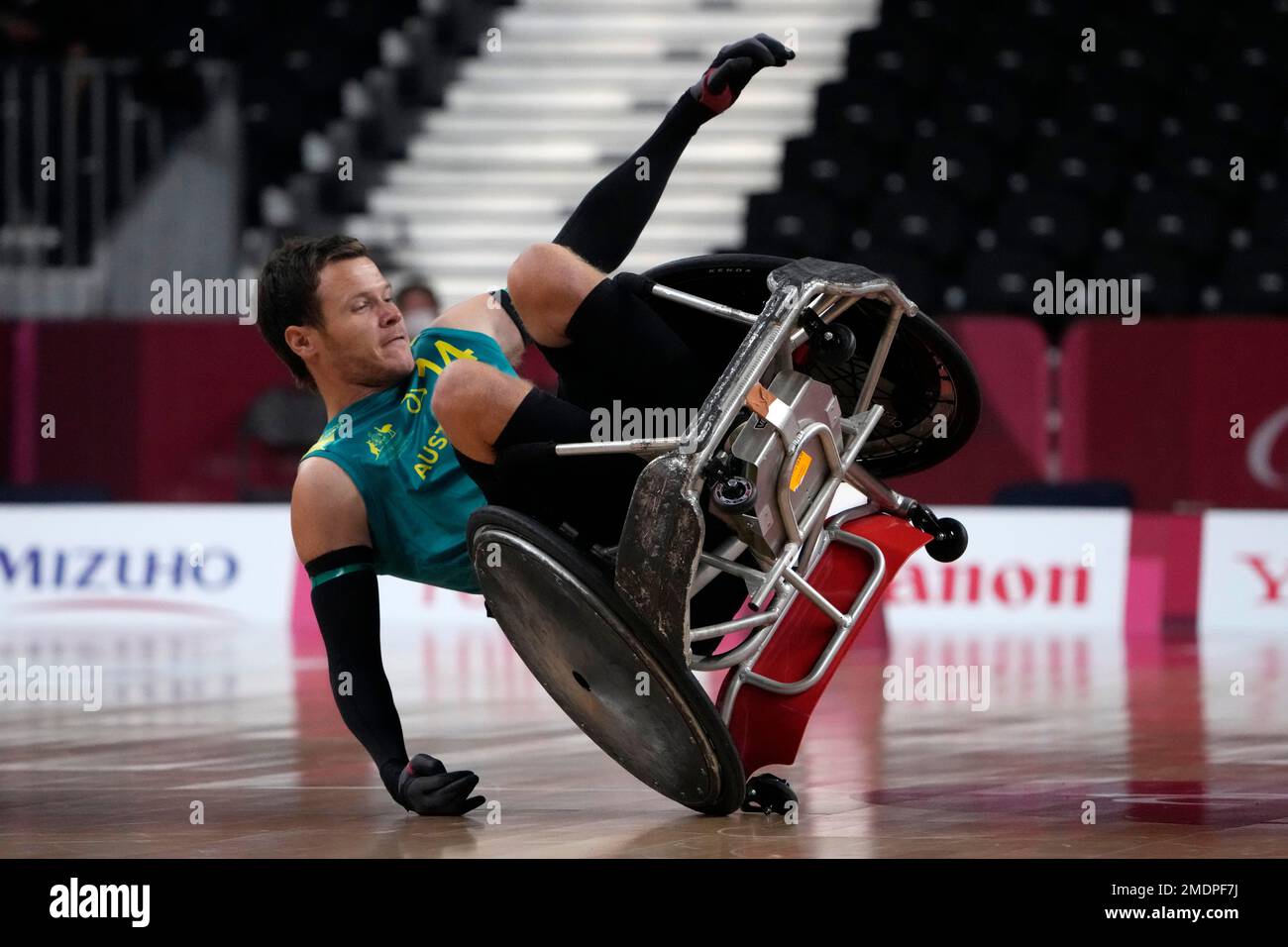 Australia's Andrew Edmondson falls during a semifinal wheelchair rugby ...