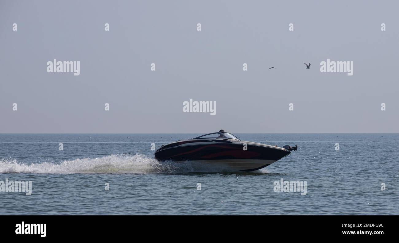 Small motorboat floats on sea hi-res stock photography and images - Alamy