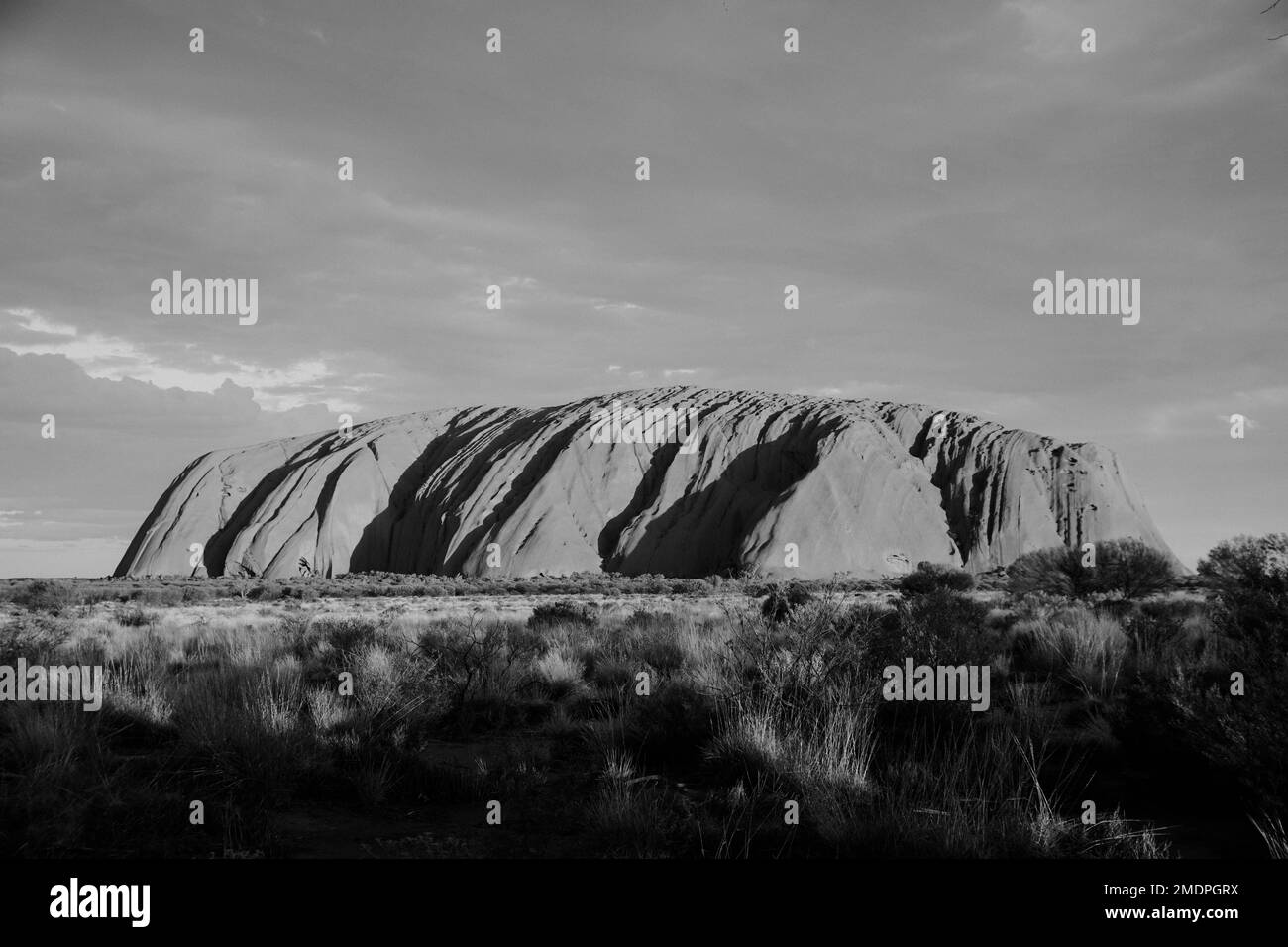 A grayscale shot of Uluru, also known as Ayers Rock. Australia Stock ...