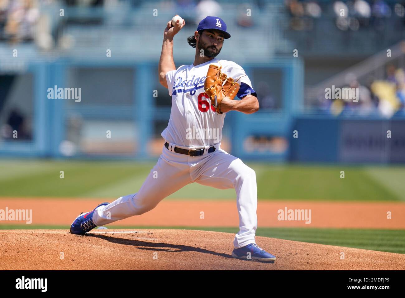 Los Angeles Dodgers starting pitcher Mitch White (66) throws during the ...