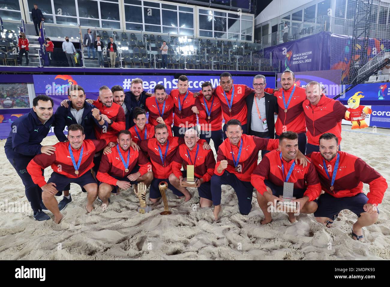 Switzerland's team players pose for a photo celebrating their third ...