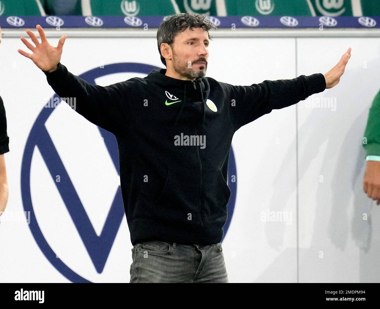 Wolfsburg's head coach Mark van Bommel celebrates after the German ...