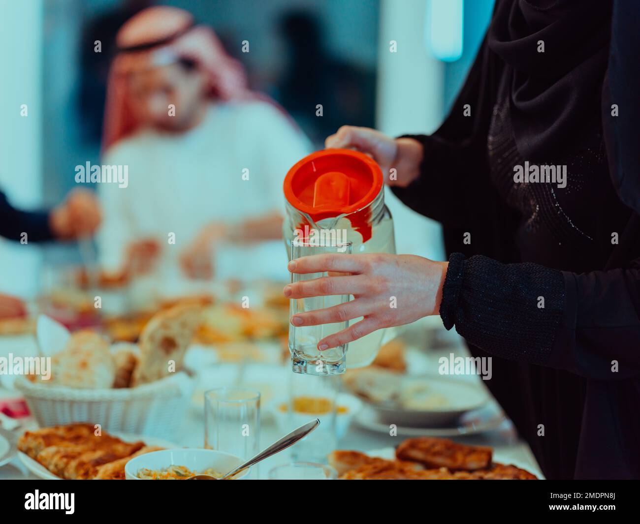 Eid Mubarak Muslim family having Iftar dinner drinking water to break ...