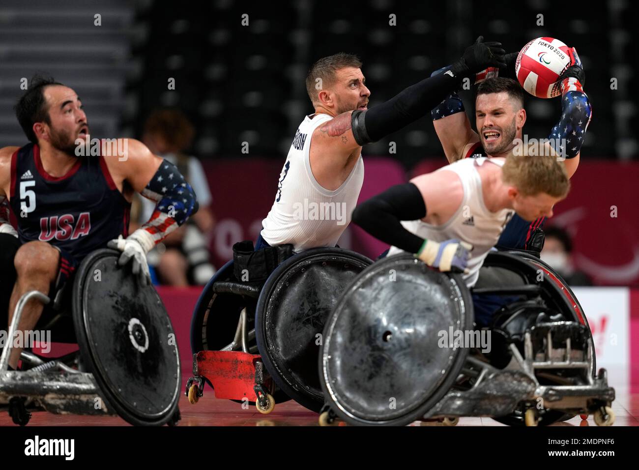 Joshua Wheeler of the United States, right, is blocked by Britain's ...