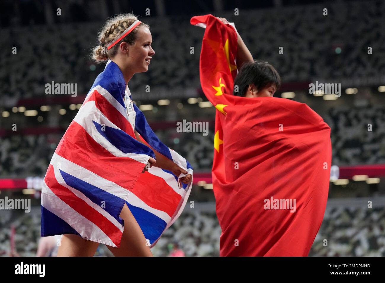 Britain's Maria Lyle, left, and China's Zhou Xia celebrate at the women ...