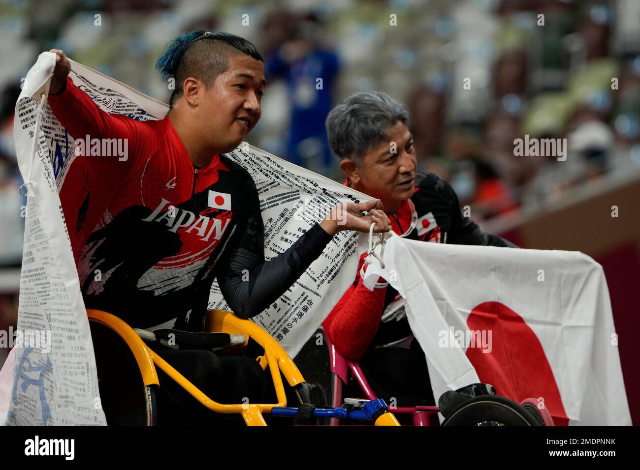Japan's Tomoki Sato, left, and Hirokazu Ueyonabaru after the men's 1500m T52 at the 2020 ...