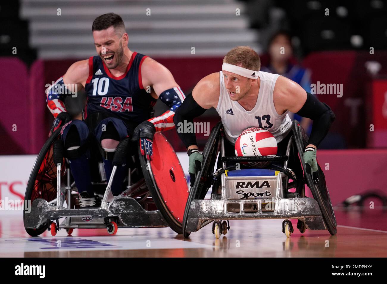 Britain's Aaron Phipps, right, moves the ball against Joshua Wheeler of ...
