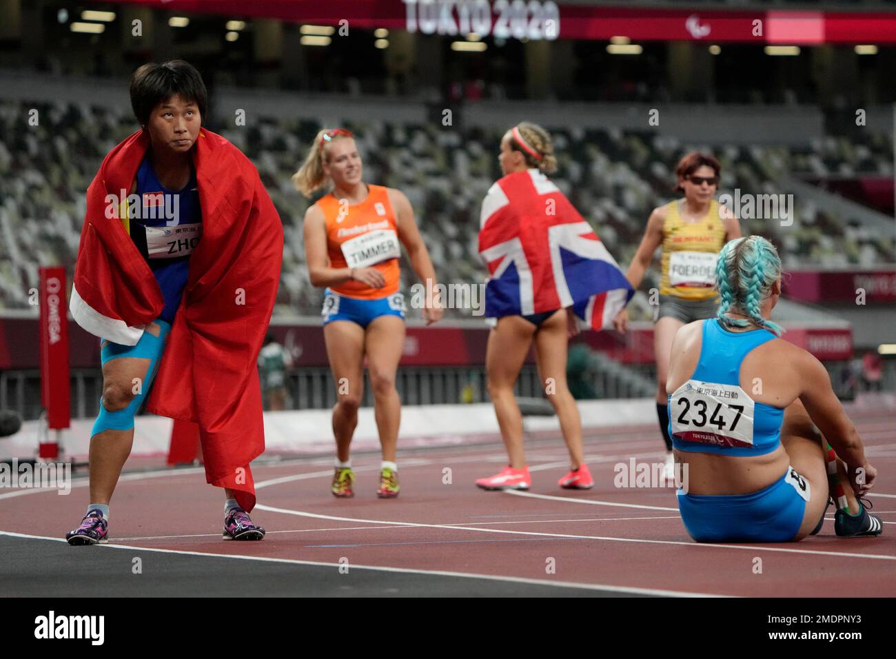 China's Zhou Xia, left, after the women's 200m T35 in the 2020 ...