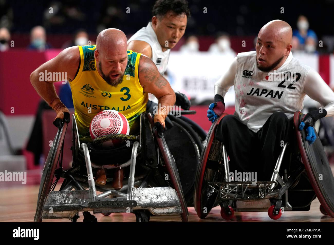 Australia's Ryley Batt, left, moves the ball against Japan's Seiya ...