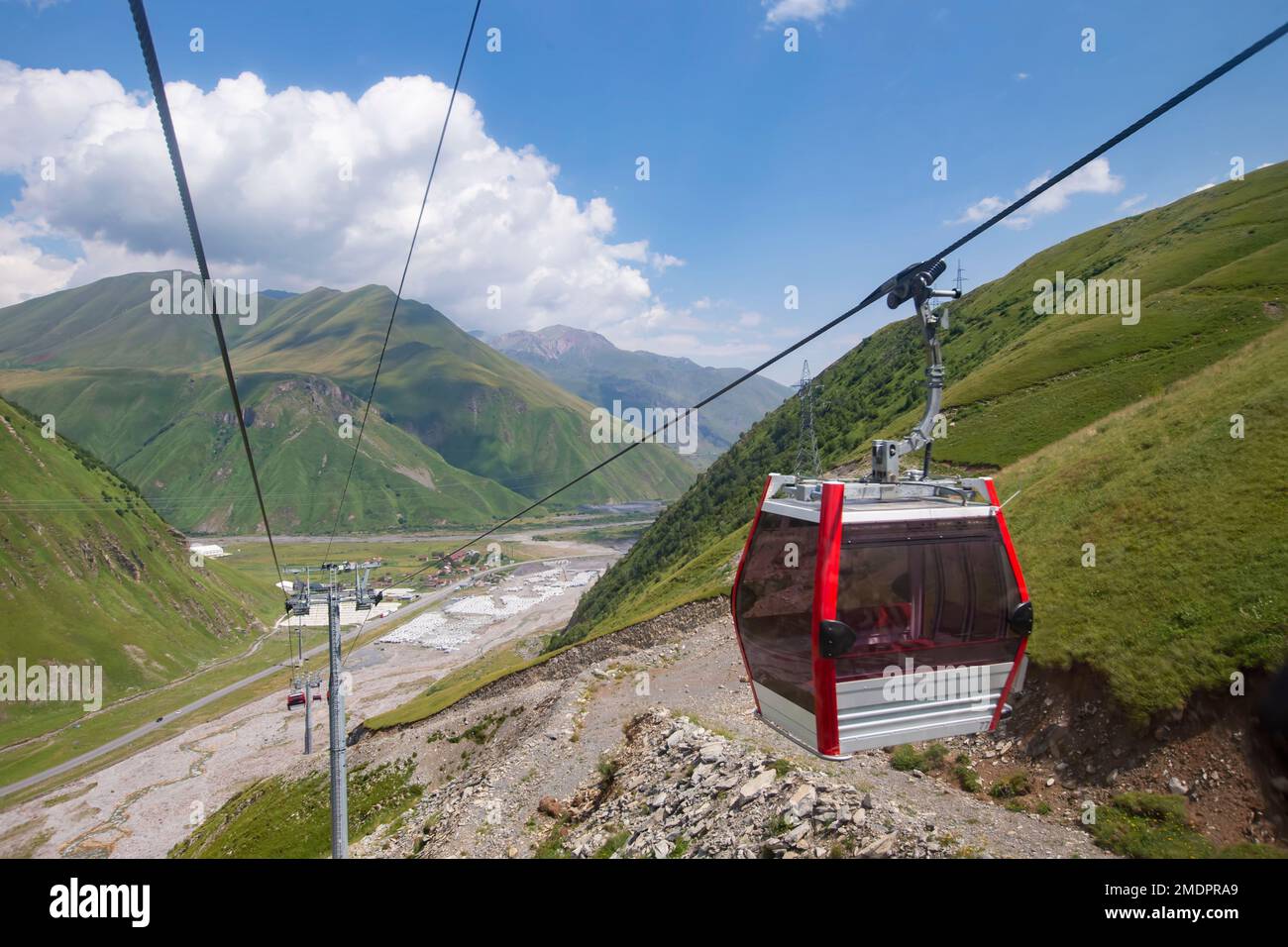 Cableway in the mountains. The landscape of the cable car of the ...