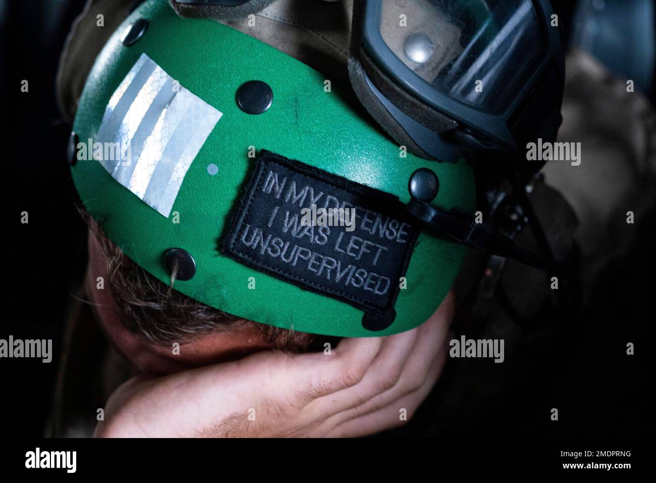 U.S. Marine Corps Lance Cpl. Brandon Oldham, rests in a VM-22 Osprey on ...