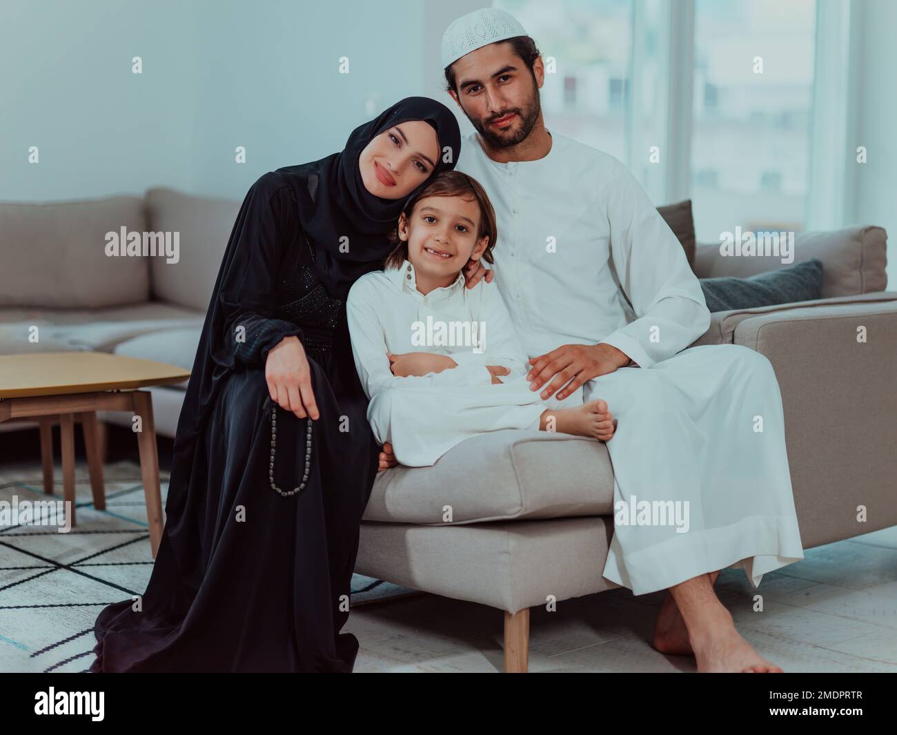 Happy Muslim family enjoying the holy month of Ramadan while praying ...