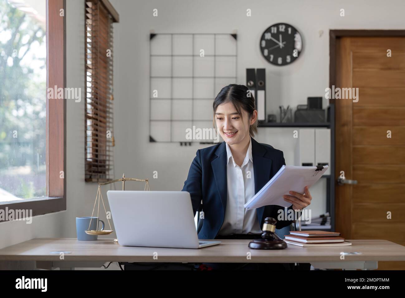 Attractive young lawyer in office Business woman and lawyers discussing ...