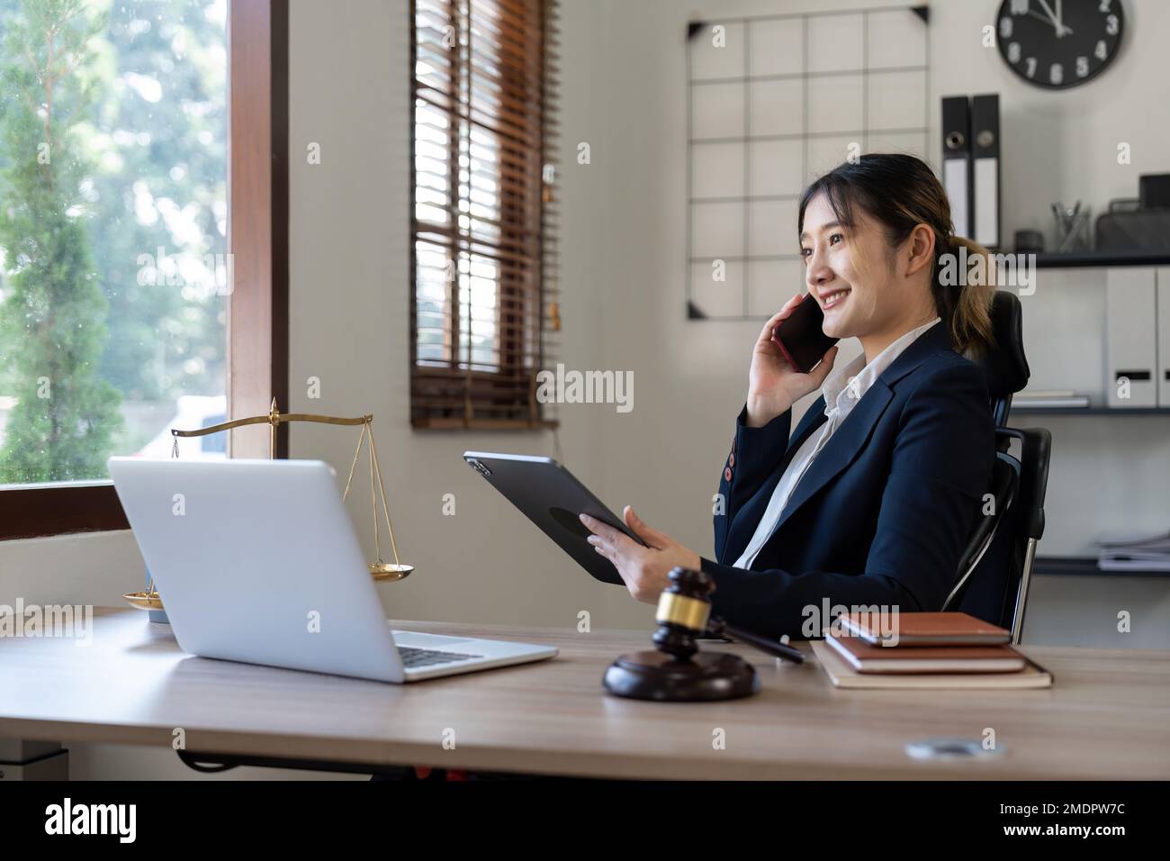 Attractive young lawyer in office Business woman and lawyers call phone ...