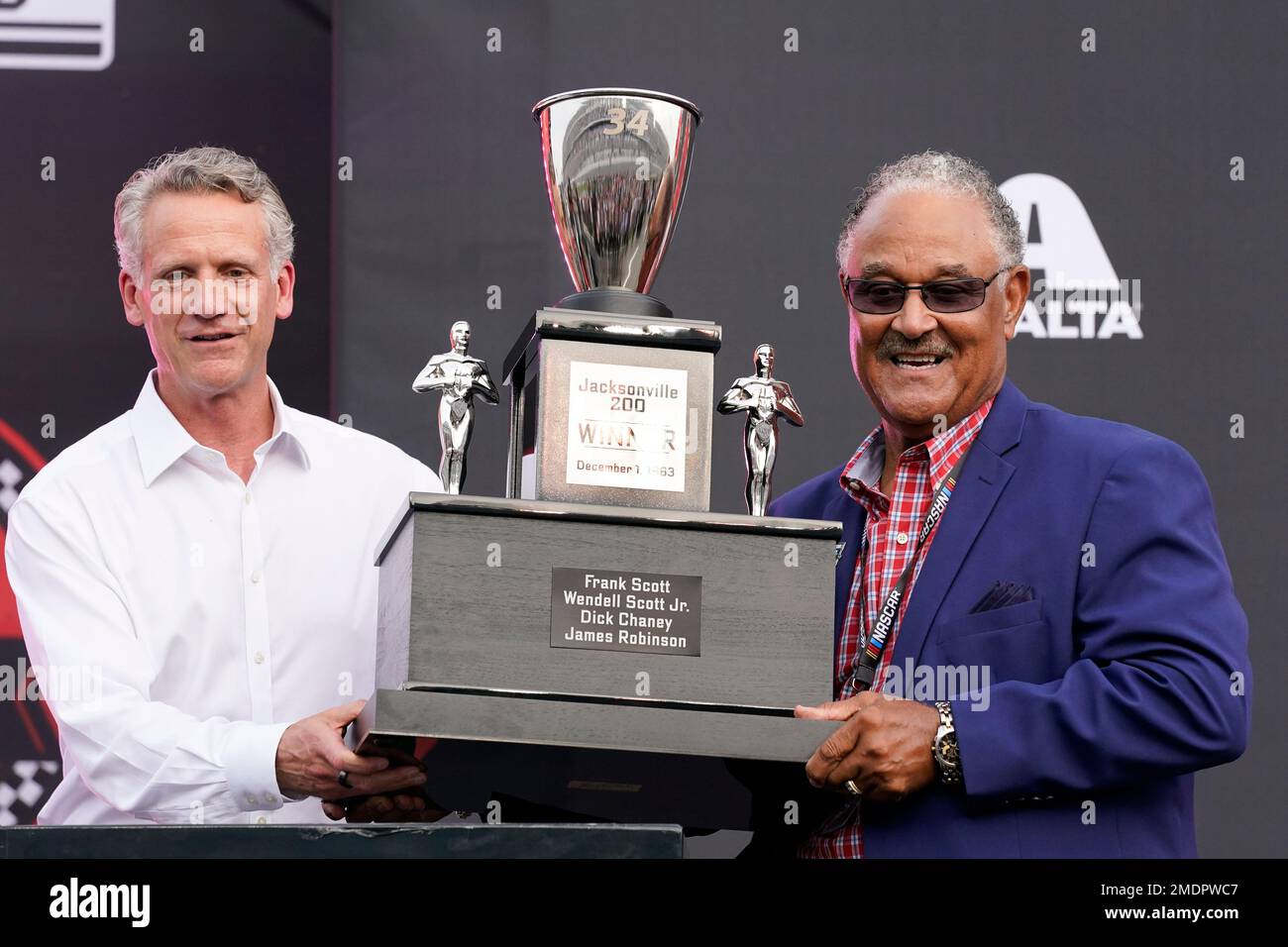 NASCAR President Steve Phelps, left, presents a trophy to Wendell Scott ...