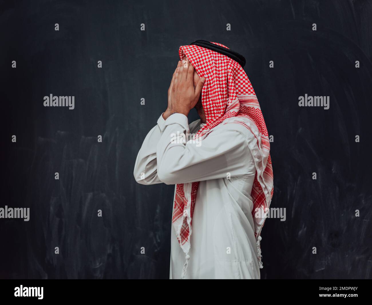 Arabian man in traditional clothes making traditional prayer to God ...