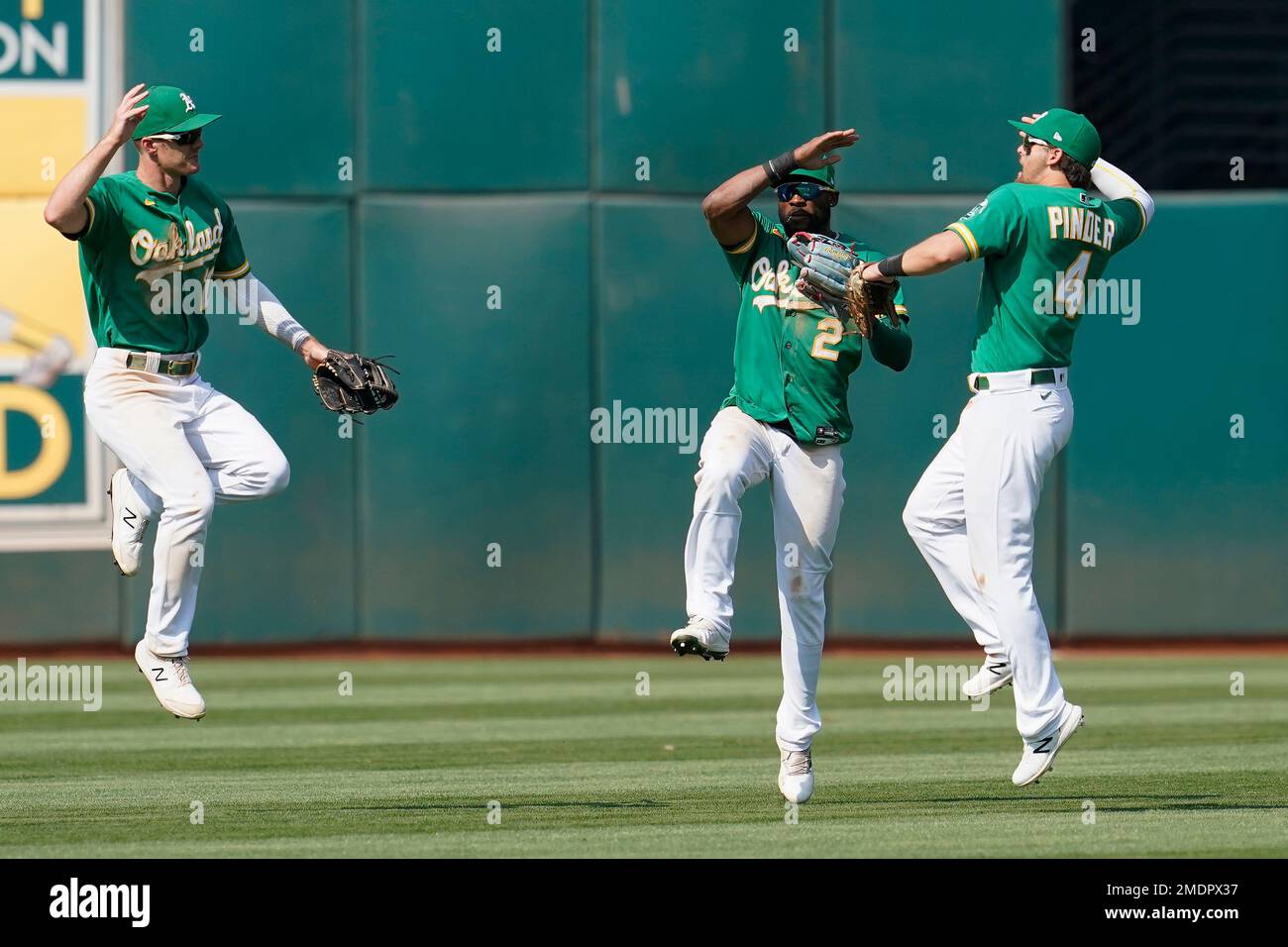 From left to right, Oakland Athletics' Mark Canha, celebrates with ...