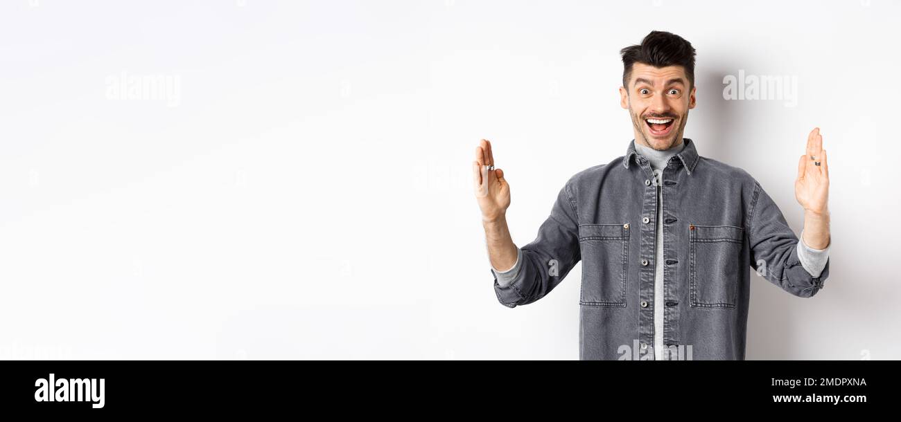Happy guy with moustache showing big size with proud excited smile ...