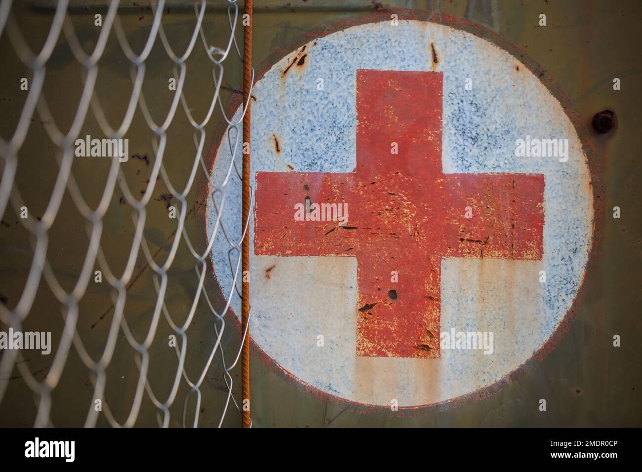 Medical red cross on a barn rusty wall Stock Photo - Alamy