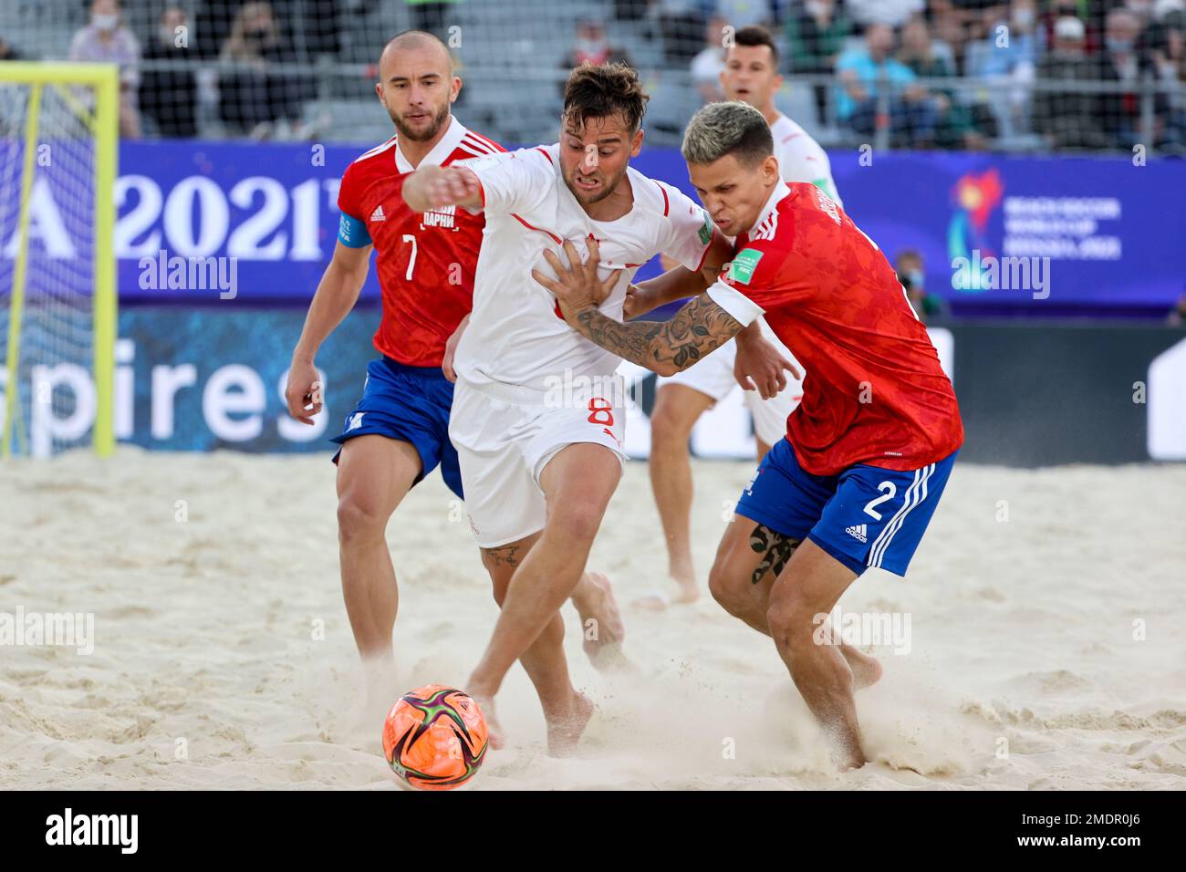 Switzerland's Philipp Borer, center, challenges for the ball with RFU's ...