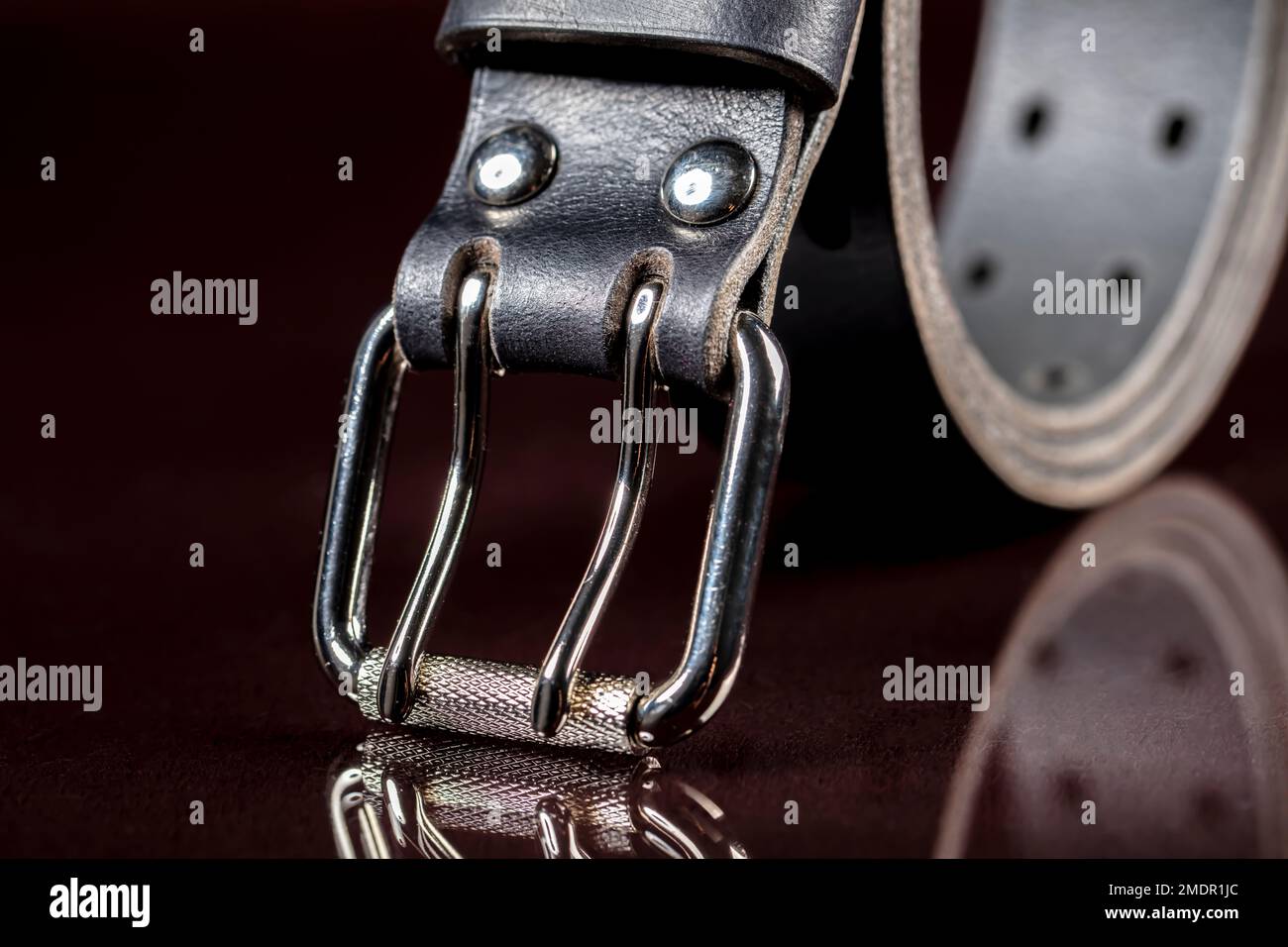 Black leather belt on a dark background. Leather products Stock Photo ...