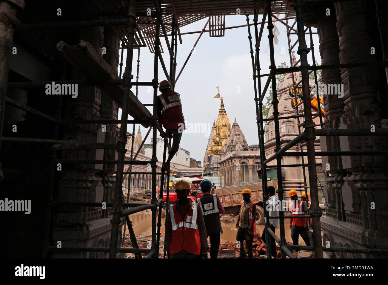 Laborers work at the under-construction Kashi Vishwanath Dham Corridor ...