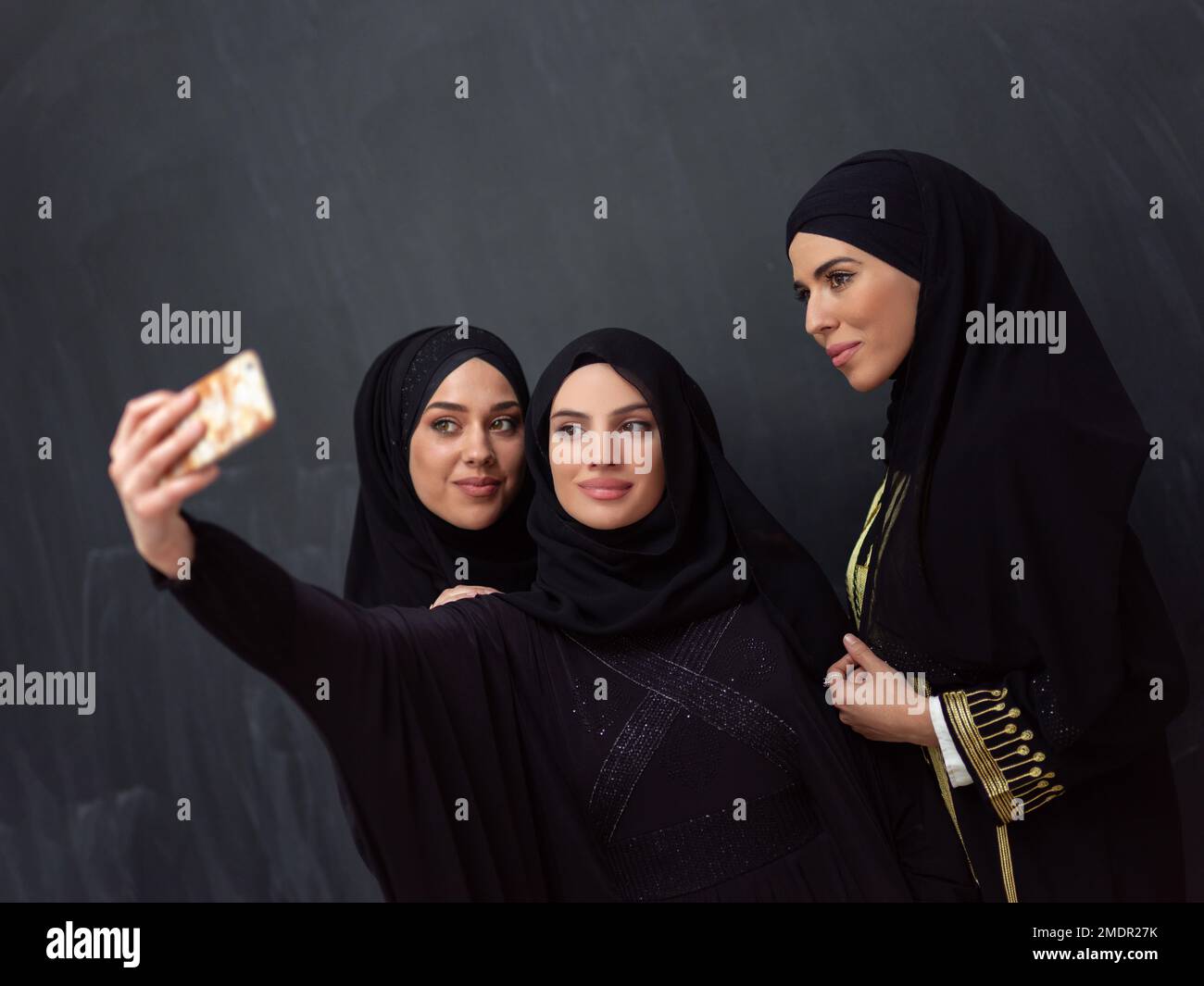 Group of young beautiful muslim women in fashionable dress with hijab ...