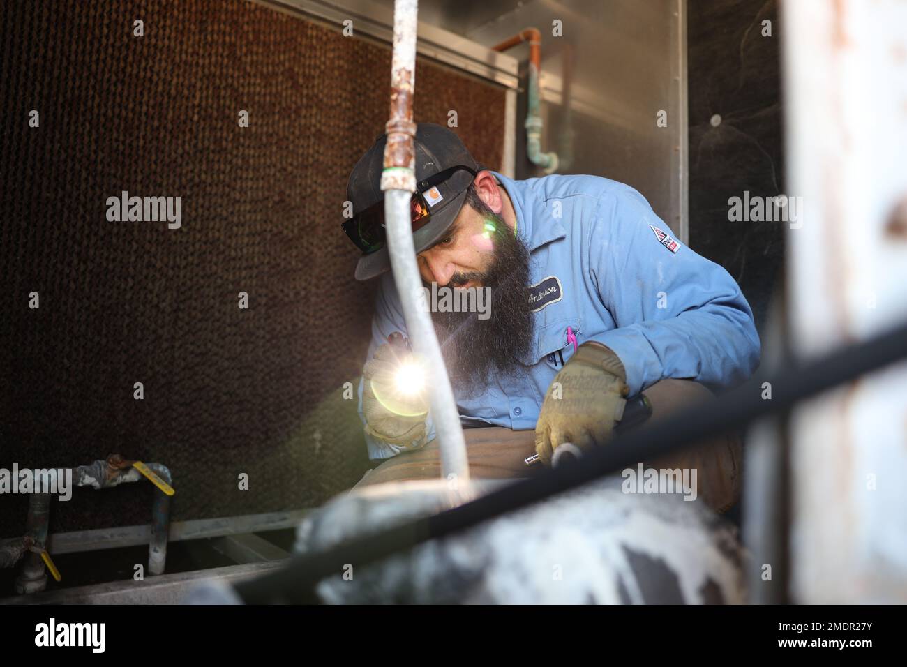 Bryan Anderson, a heating, ventilation, and air conditioning (HVAC ...