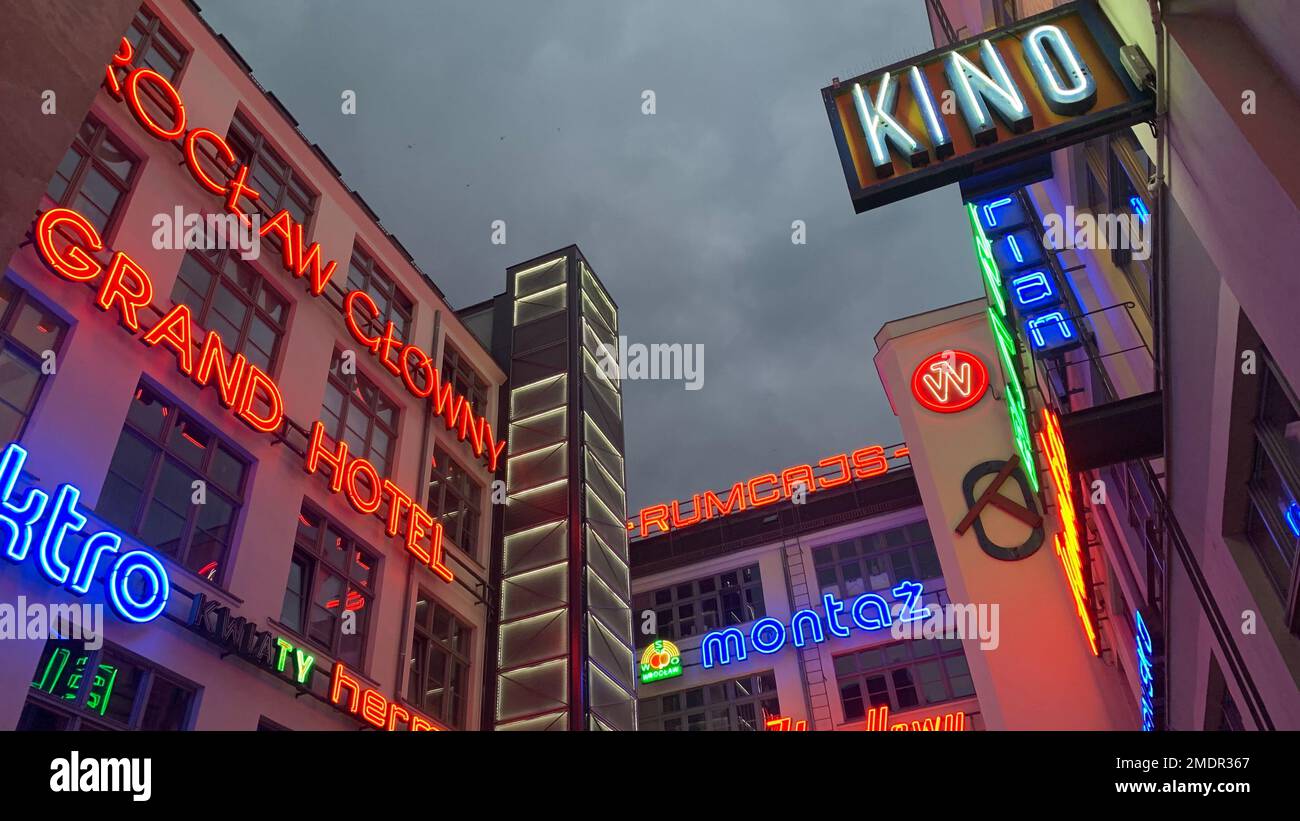 A view of a courtyard with neon signs in Poland in the city of Wroclaw ...
