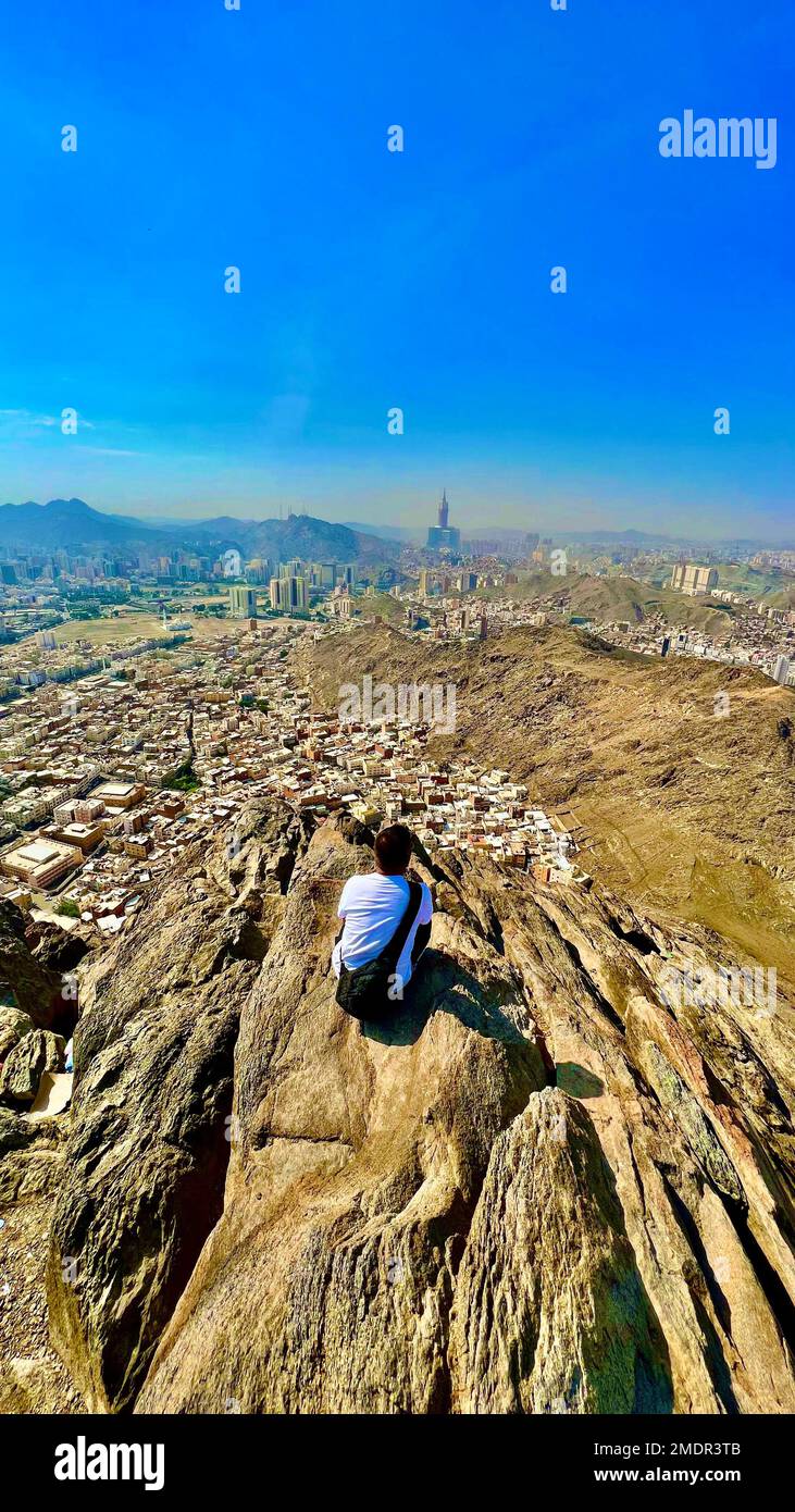 A traveler viewing the seven grand mountains of Makkah, Saudi Arabia ...