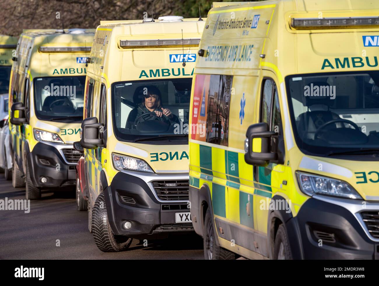 An ambulance worker responds to a call from the picket line outside ...