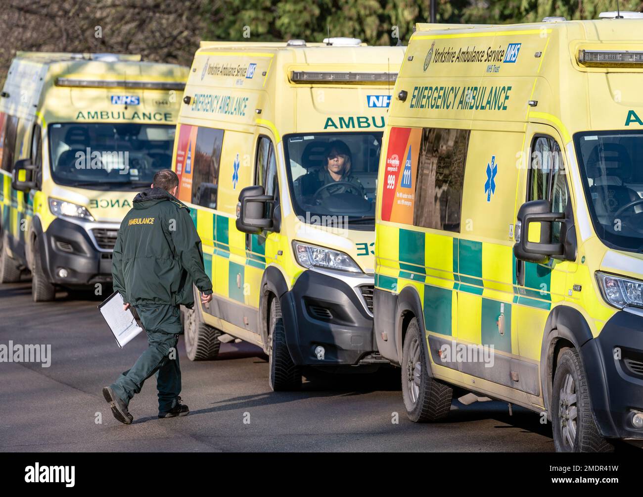 Ambulance workers respond to a call from the picket line outside ...